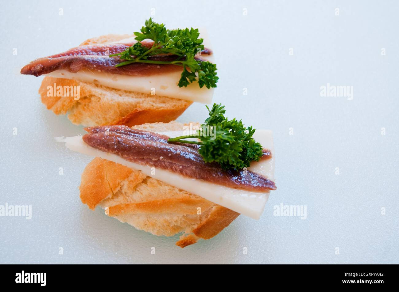 Anchovy fillets and Manchego cheese, typical Spanish tapa. Spain Stock ...