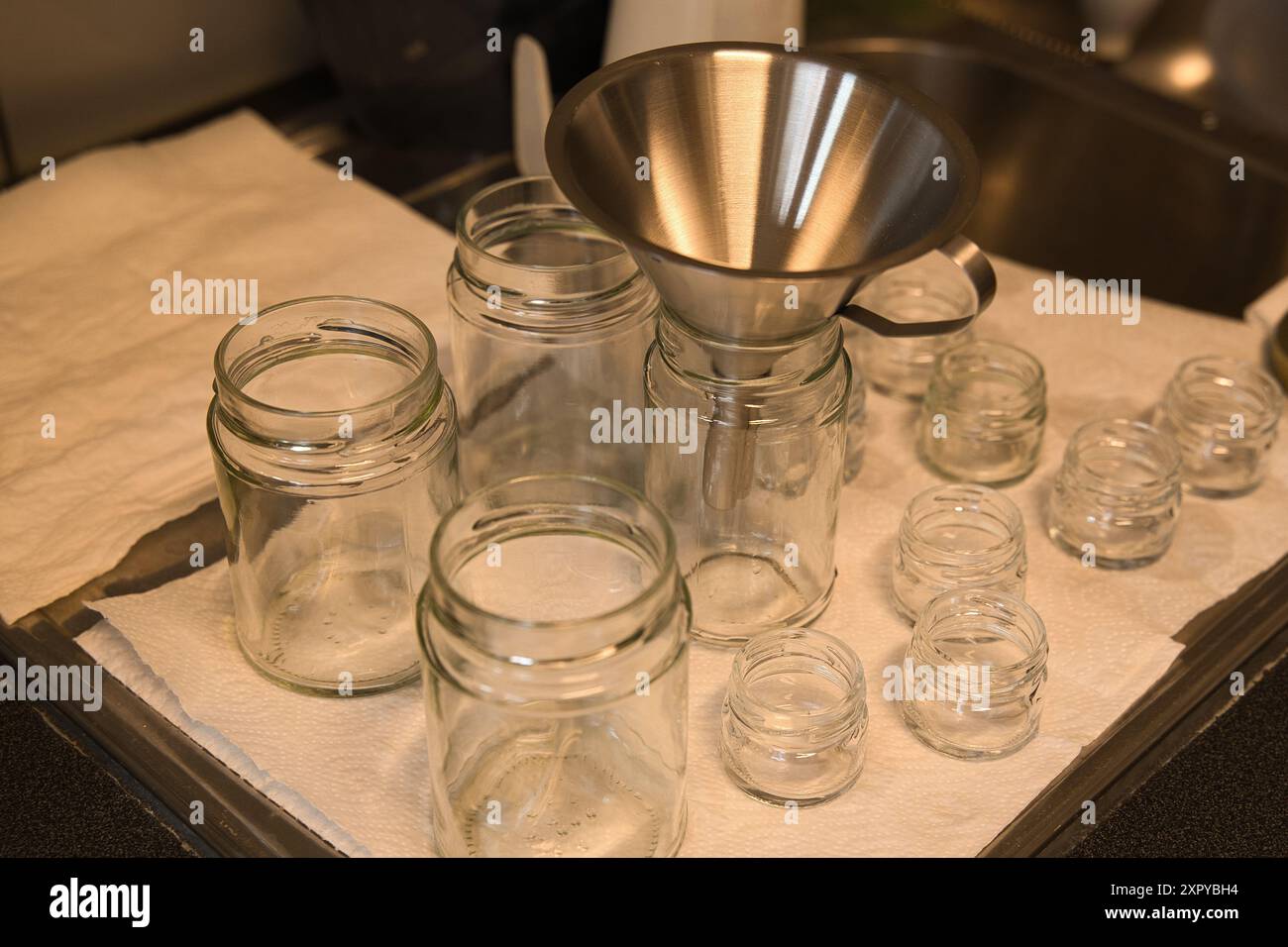 Jars with funnel are ready for filling Stock Photo - Alamy