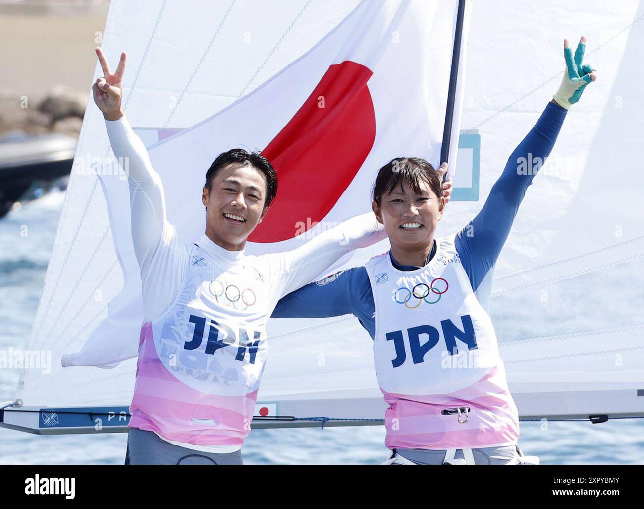 Japan's Keiju Okada (L) and Miho Yoshioka celebrate after winning ...
