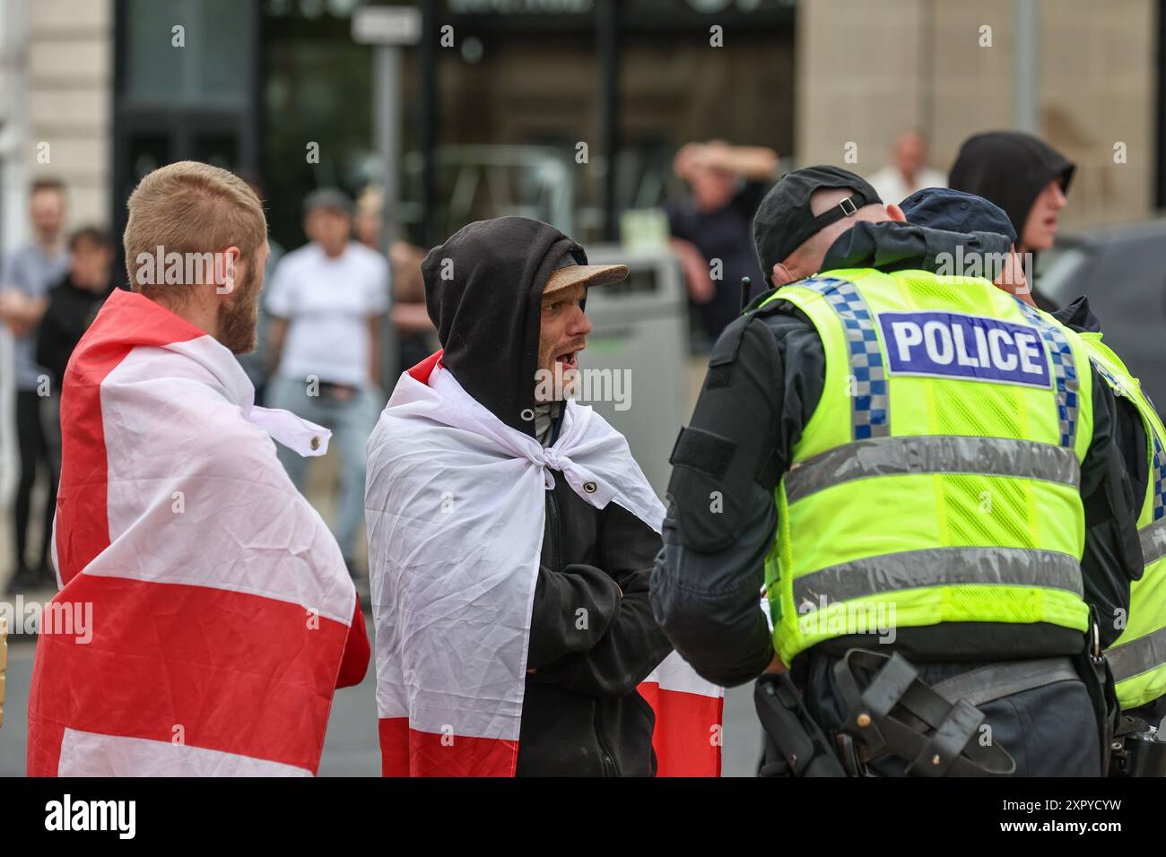 Police start taking details from people in the crowd as the ...