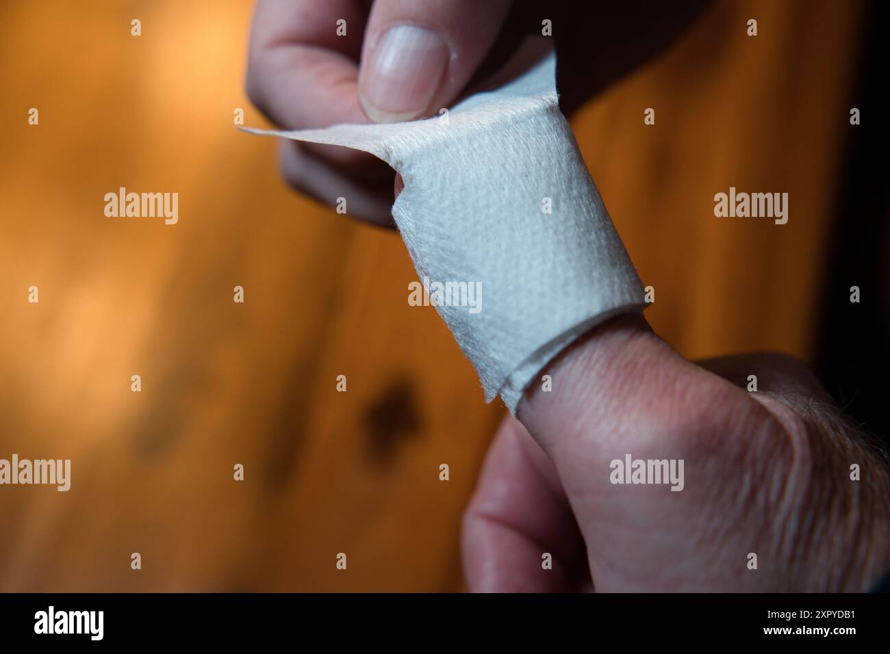 the fingertip of the thumb is bandaged Stock Photo - Alamy