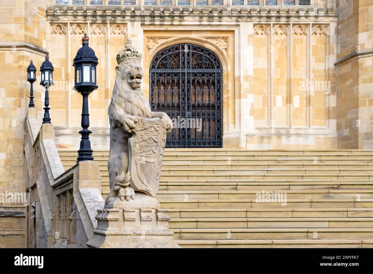 Stone lion bearing a shield with the royal arms, on the steps of the ...