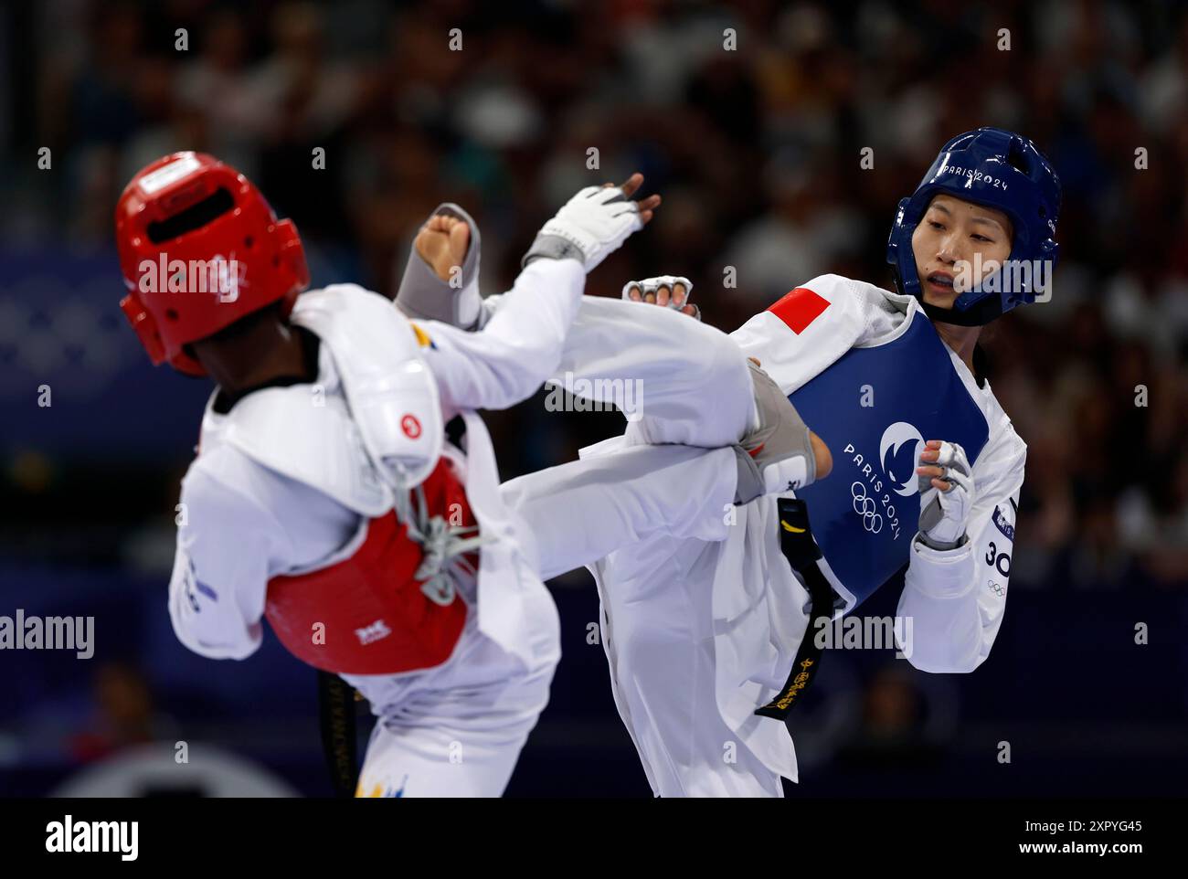 Paris, France. 8th Aug, 2024. Luo Zongshi (R) of China competes against ...