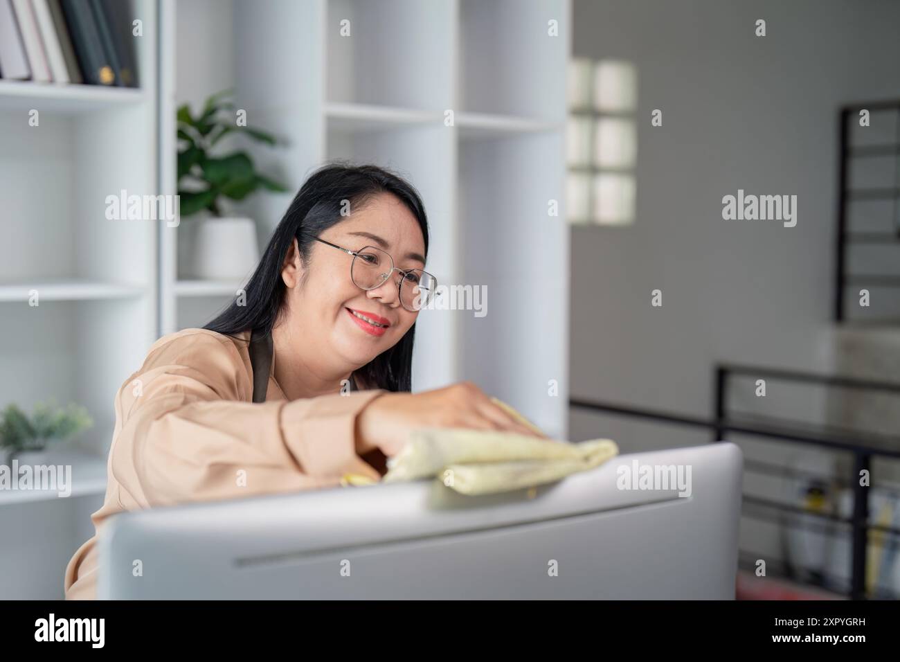 Smiling Maid Housekeeper Cleaning Modern Home Interior with Cloth in ...
