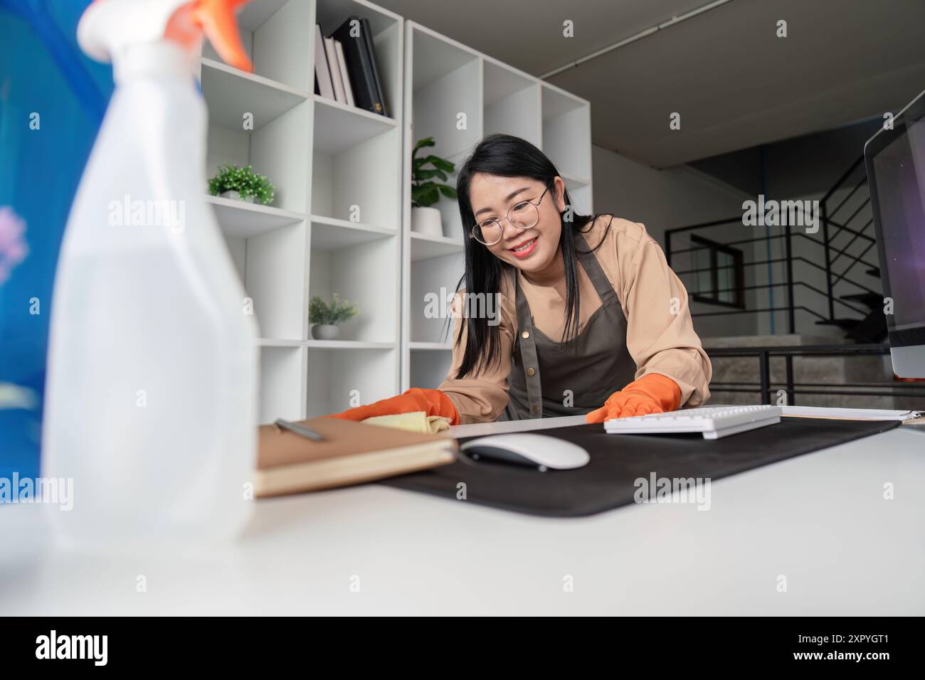 Smiling Maid Housekeeper Cleaning Modern Office Desk with Spray Bottle ...