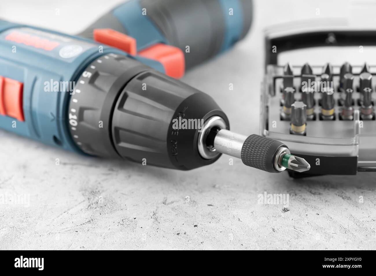 Professional cordless drill screwdriver and screwdriver bit set close ...