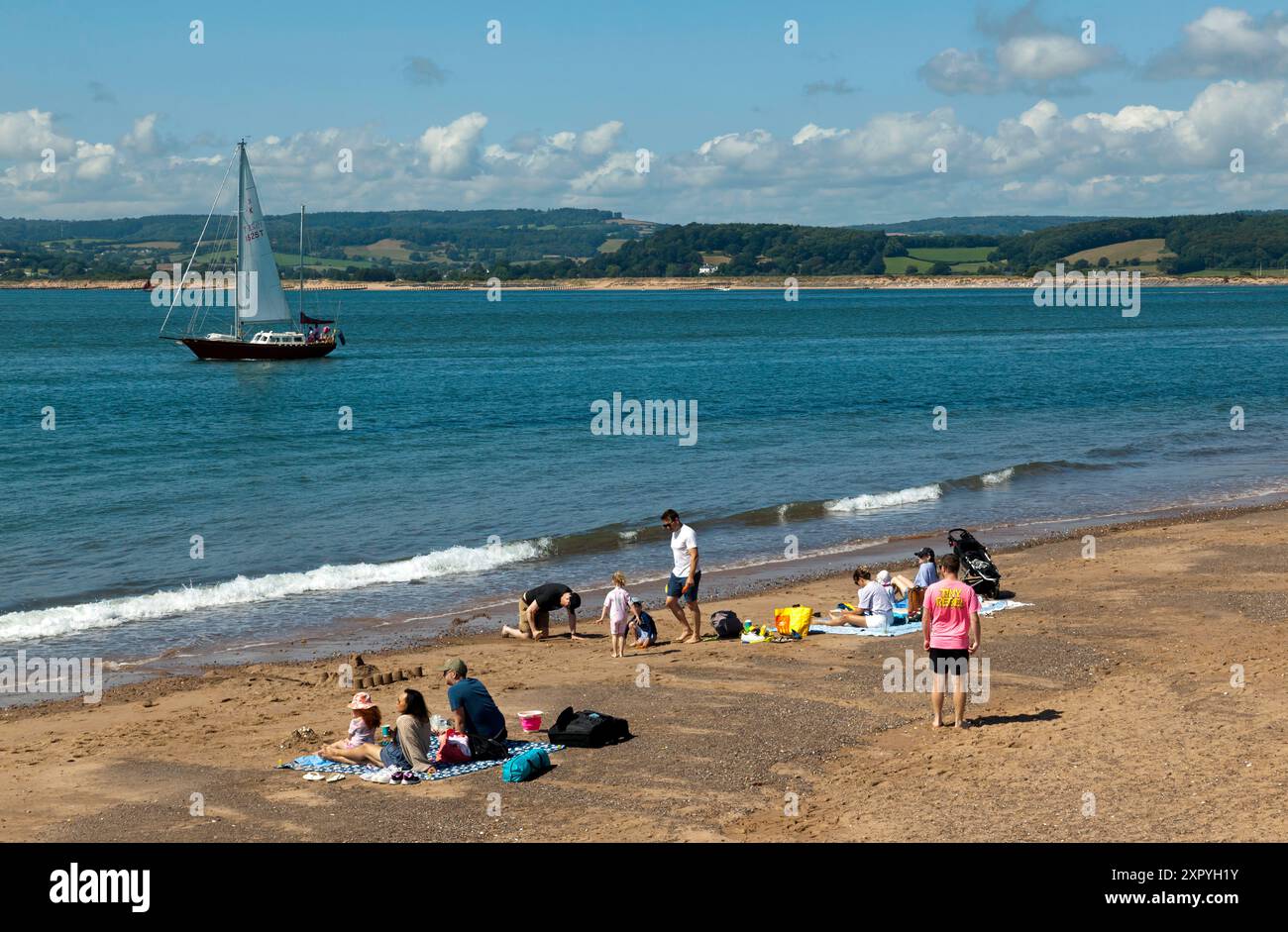A Motor yacht sailing down Exmouth Beach, in the estuary of the River ...