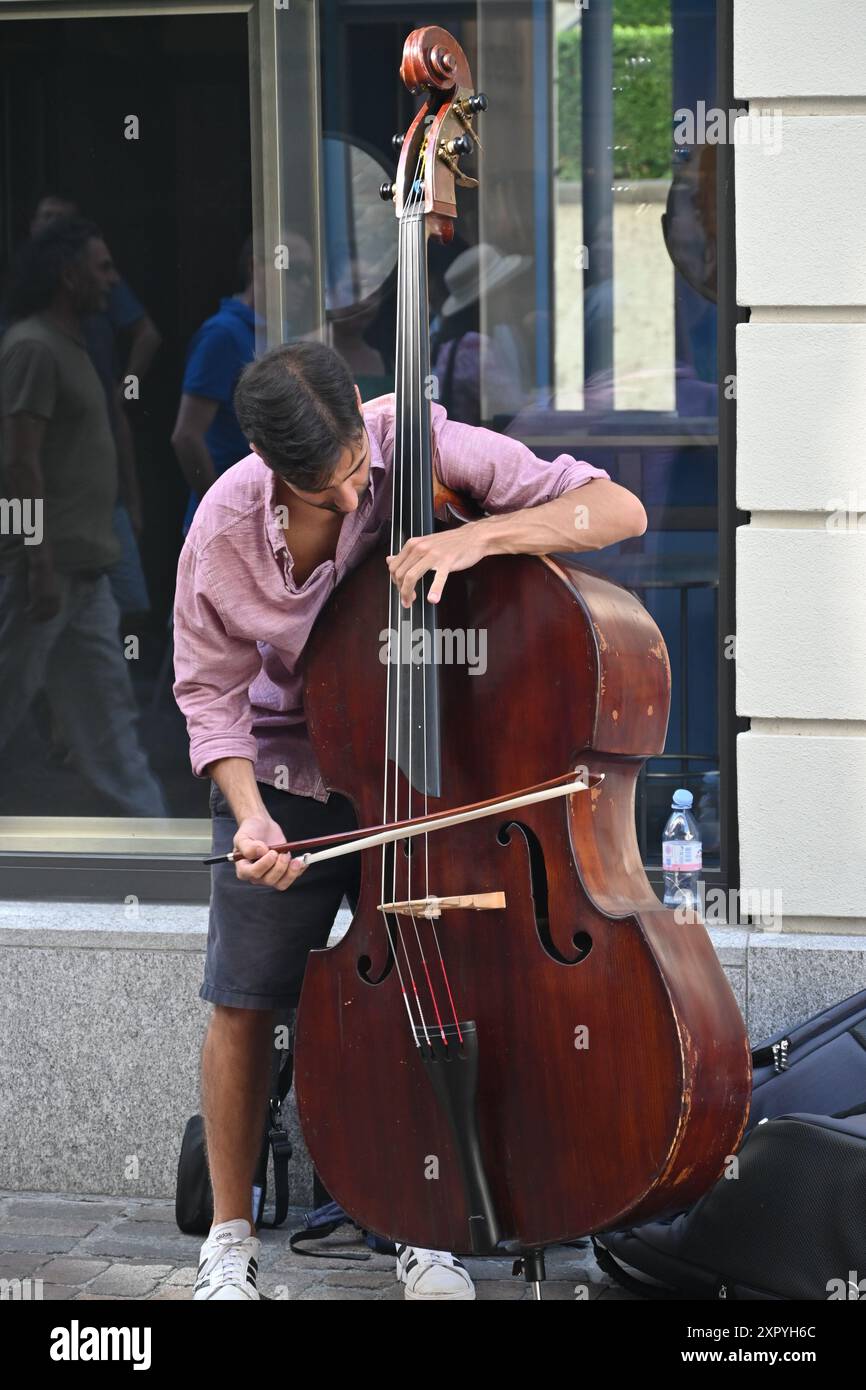 Swiss musician playing double bass on the street in Lucerne ...