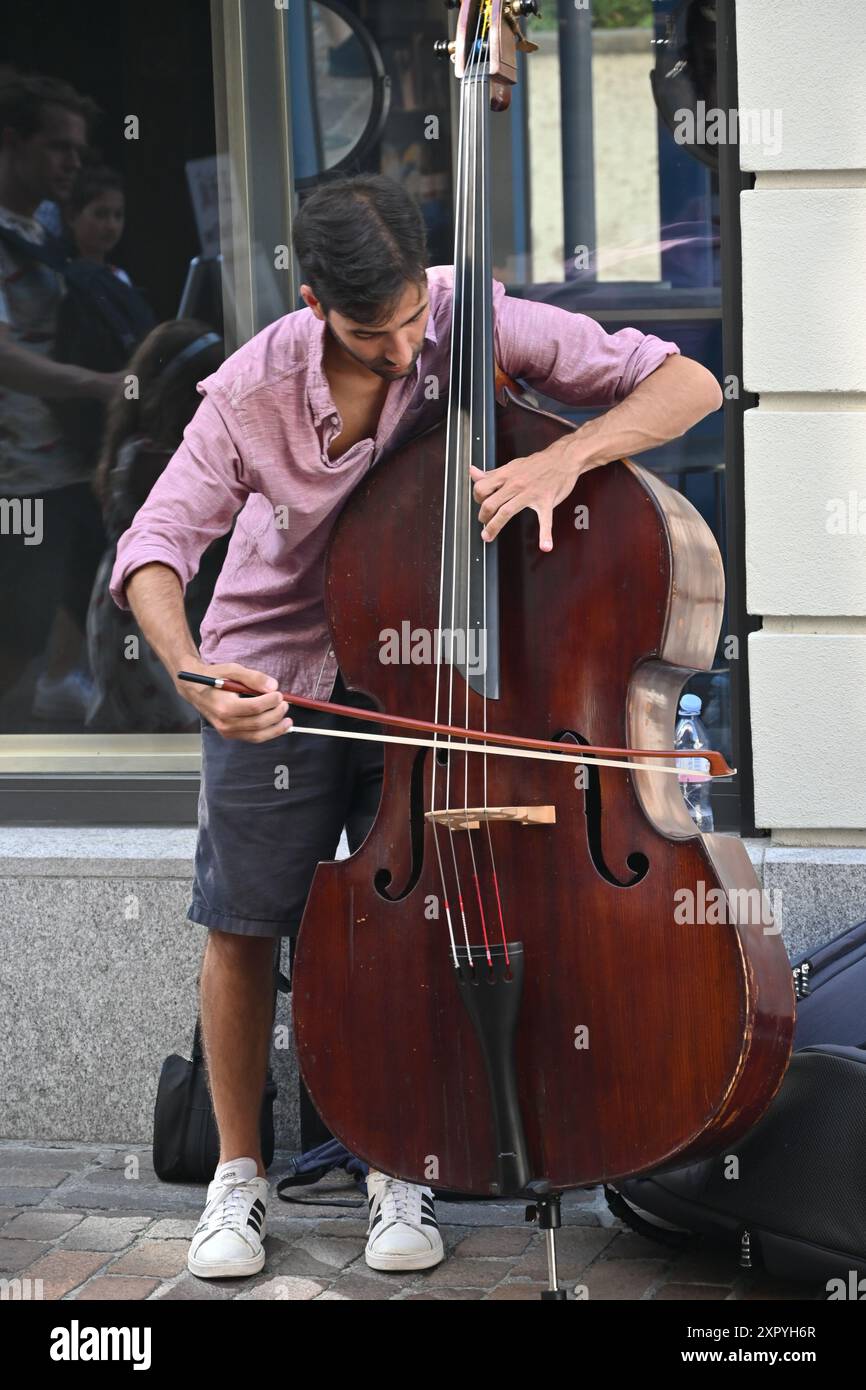 Swiss musician playing double bass on the street in Lucerne ...