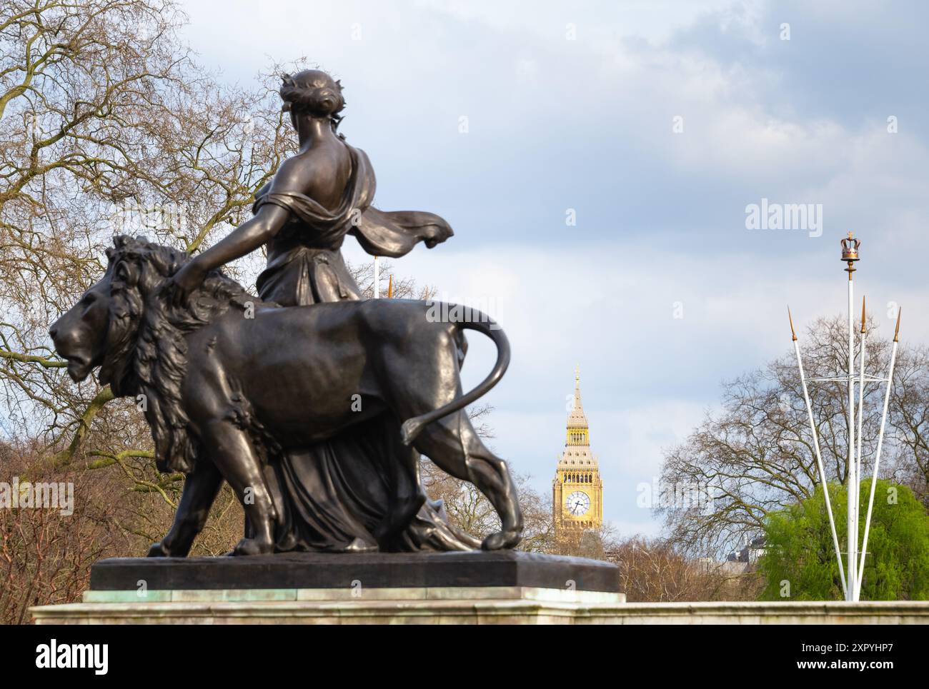 Bronze figure of Peace supported by a bronze lion, with Big Ben in the ...