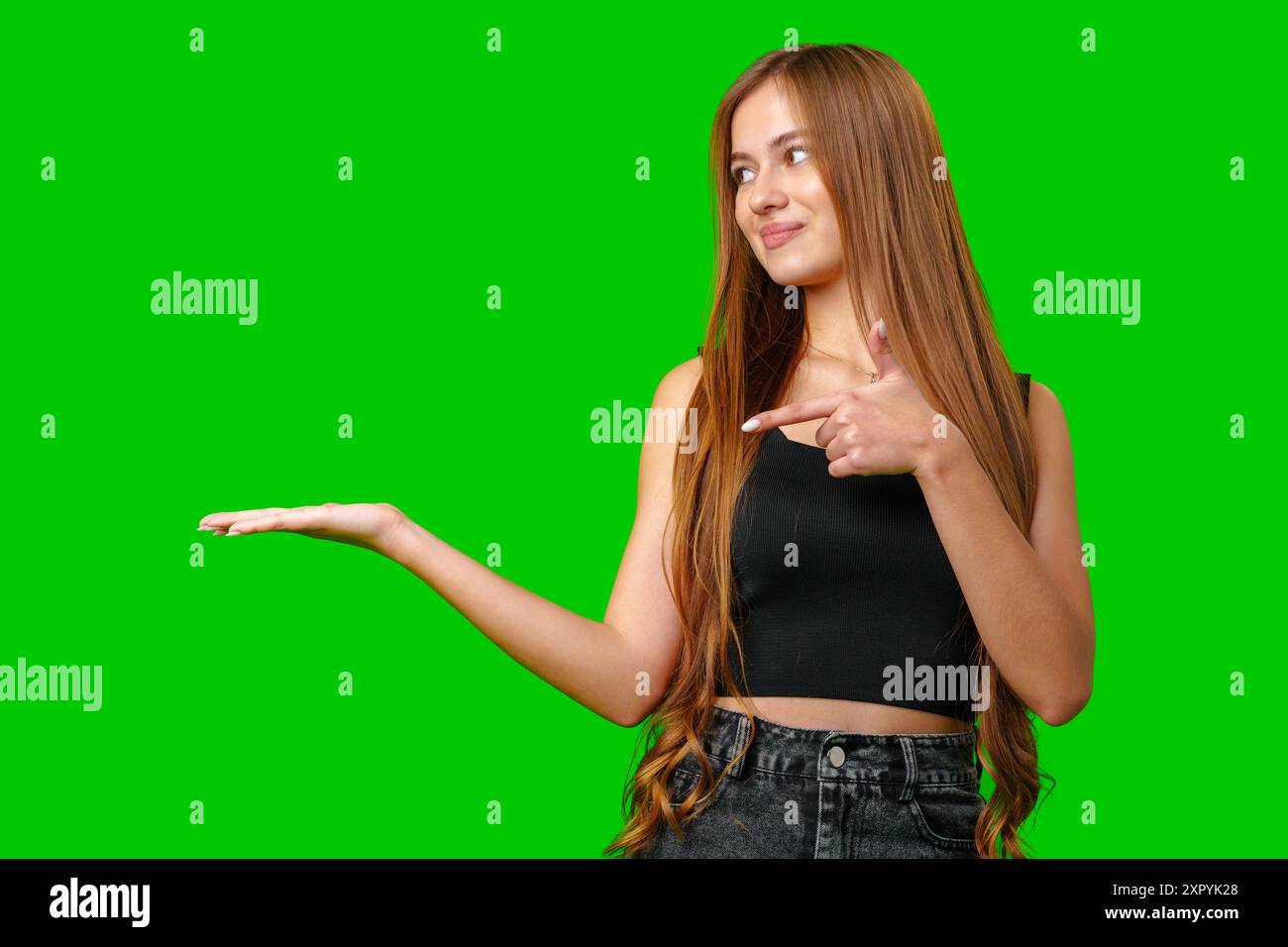Woman Pointing at Something on Green Screen Stock Photo - Alamy
