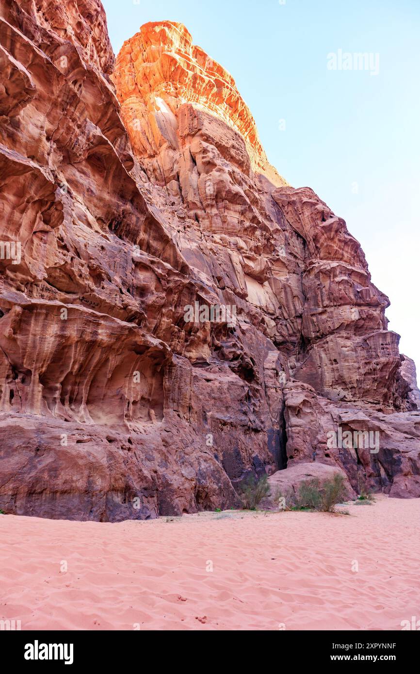 Landscape of the Wadi Rum desert in Jordan. Mountain top illuminated by ...