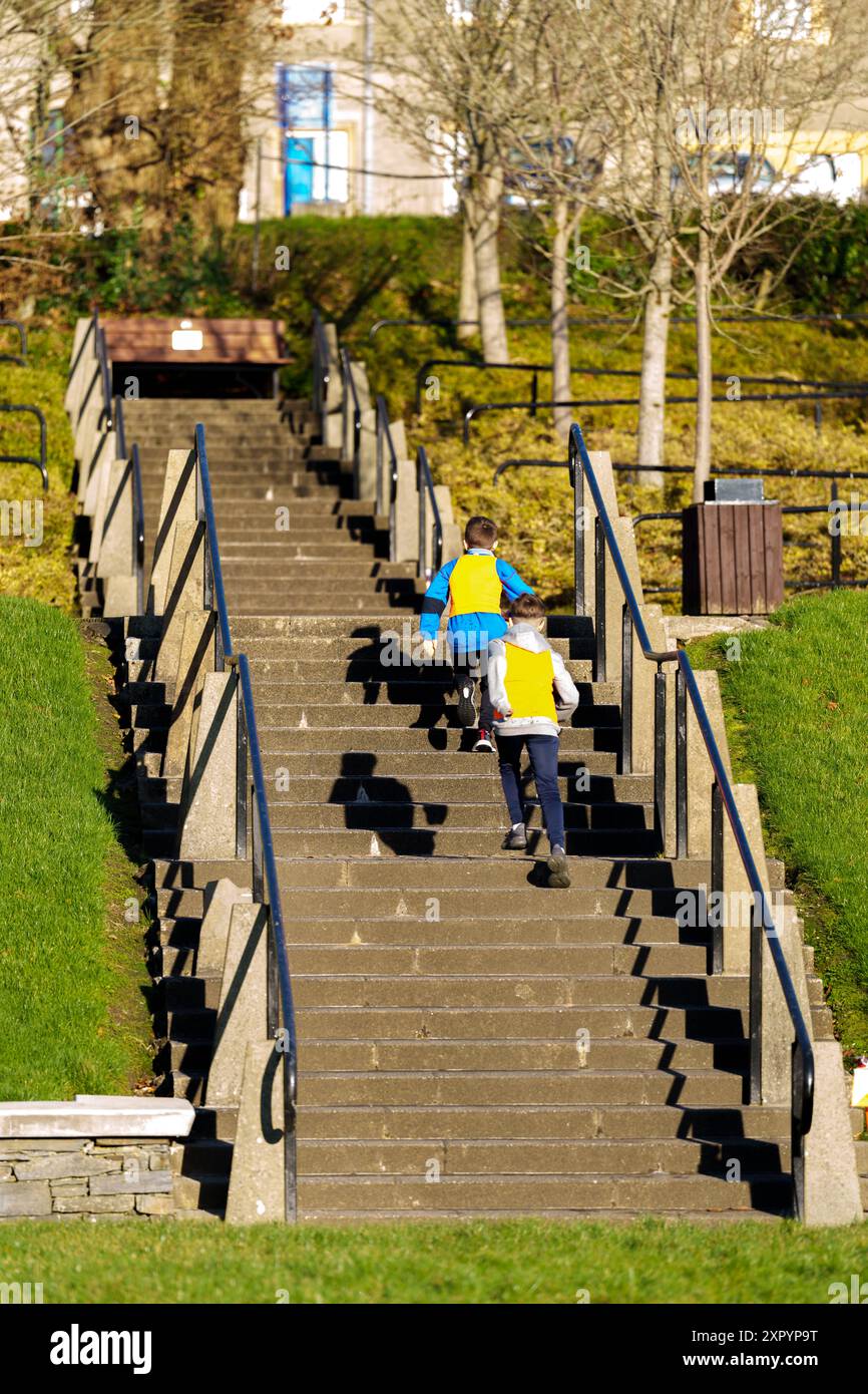 Primary school children on an orienteering lesson in the park Stock ...