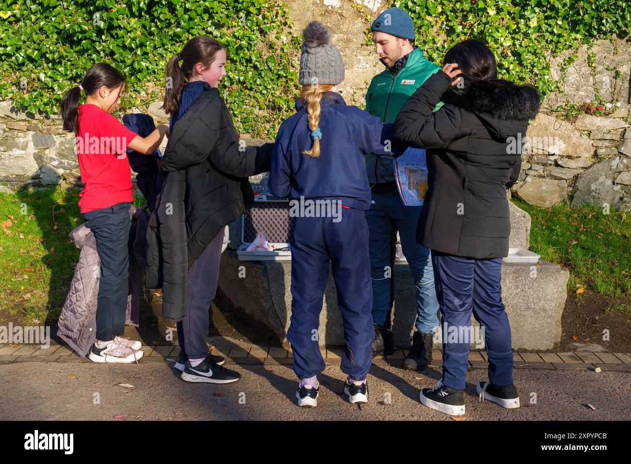 Primary school children on an orienteering lesson in the park Stock ...