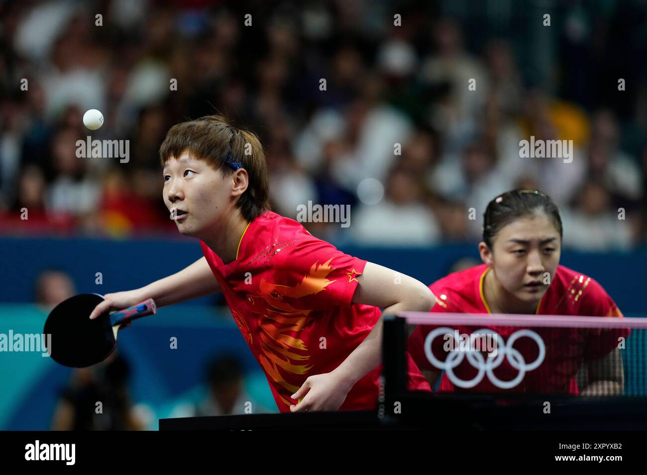 China's Wang Manyu, foreground, and Chen Meng play against South Korea ...