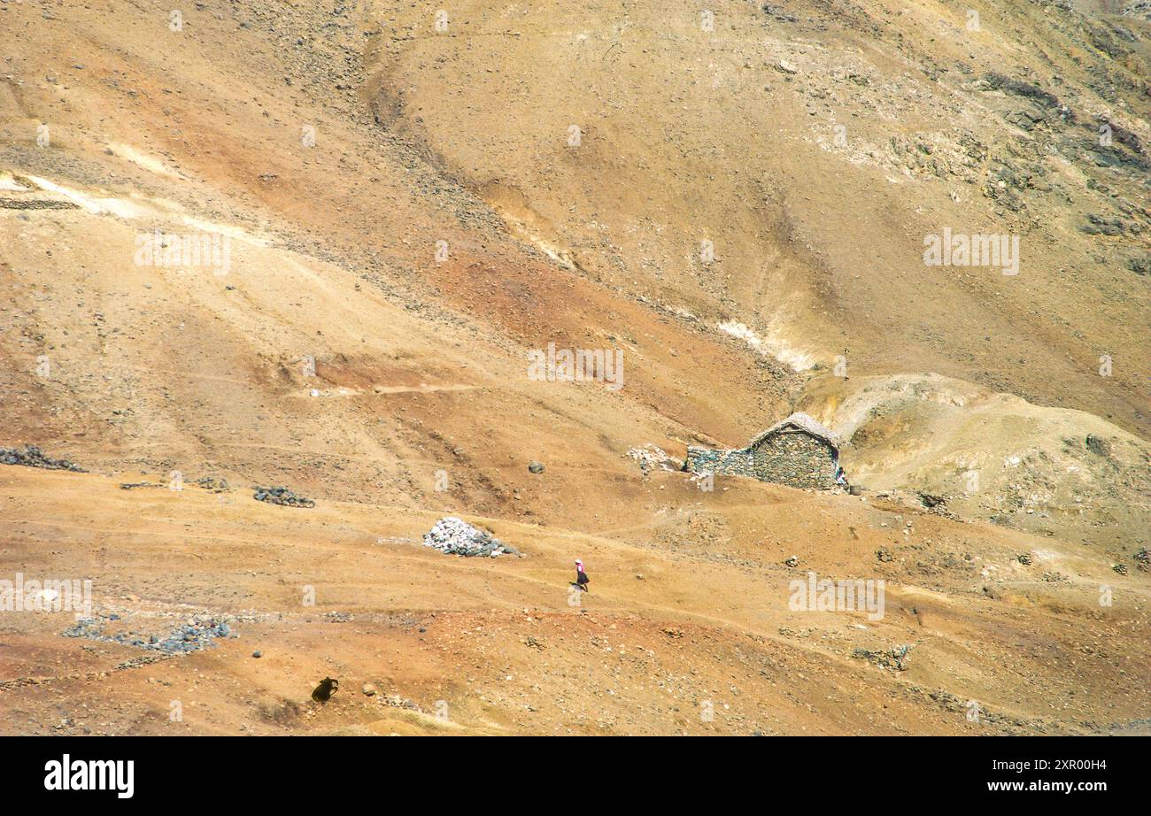 Cape Verde, Santiago Island, woman walks through the dry hills of the ...