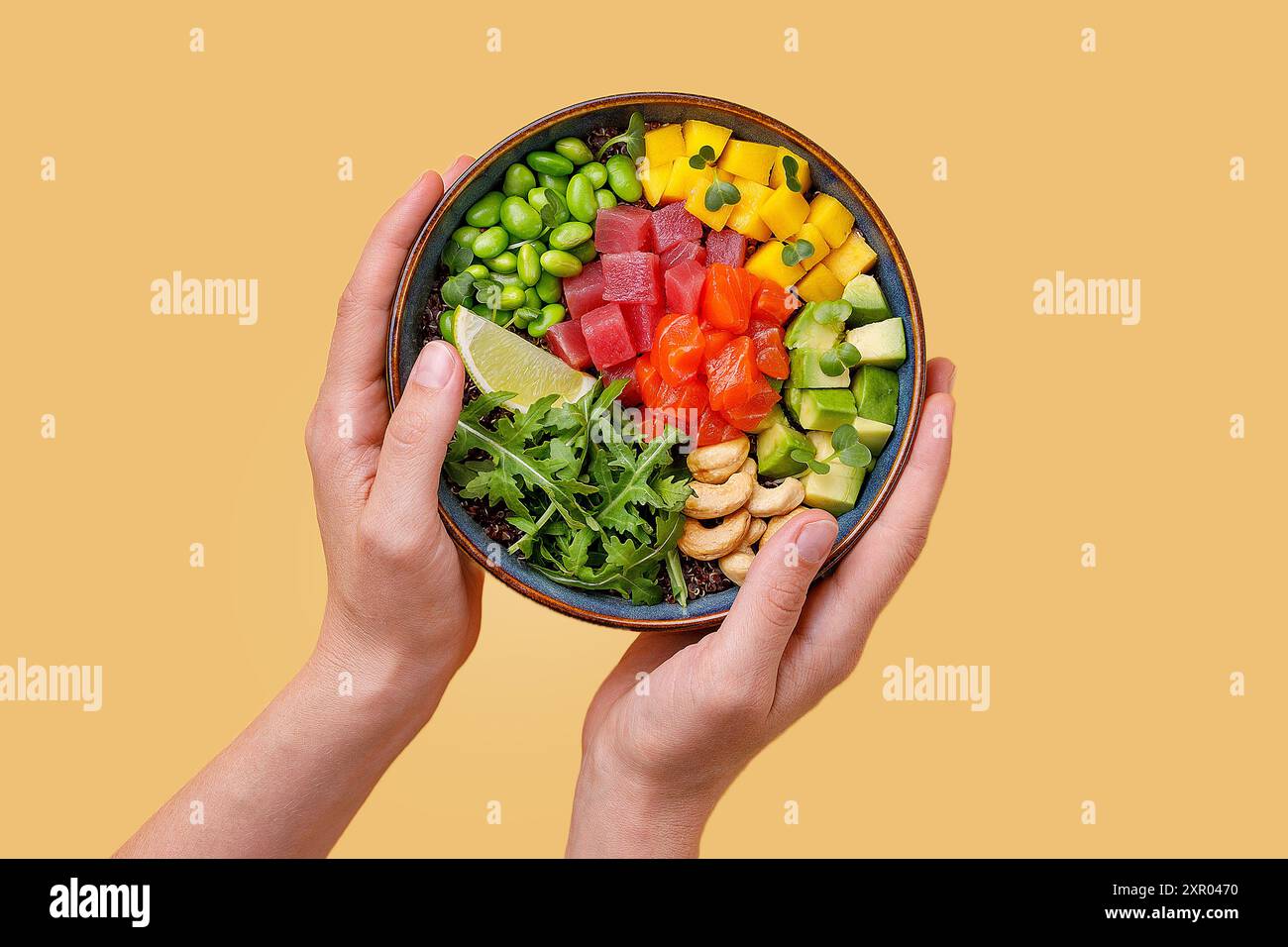 Woman eating Poke bowl. Female hands holding chopsticks eating Poke ...