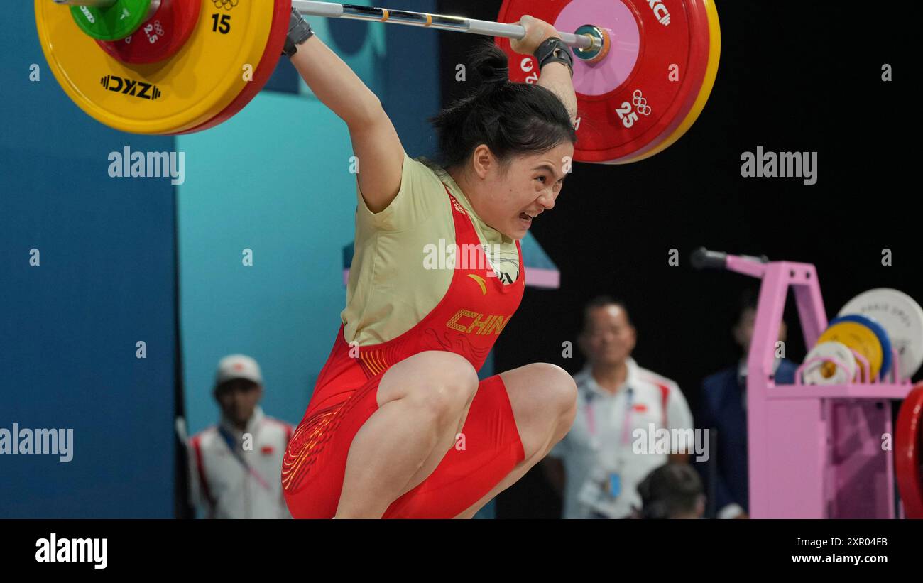 Luo Shifang of China competes during the women's 59kg weightlifting ...