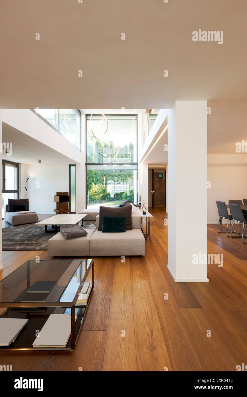 Modern living room with large sofa, with chaise longue, central coffee ...