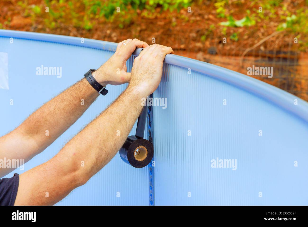 Installation of metal frame for above ground pool is currently in ...
