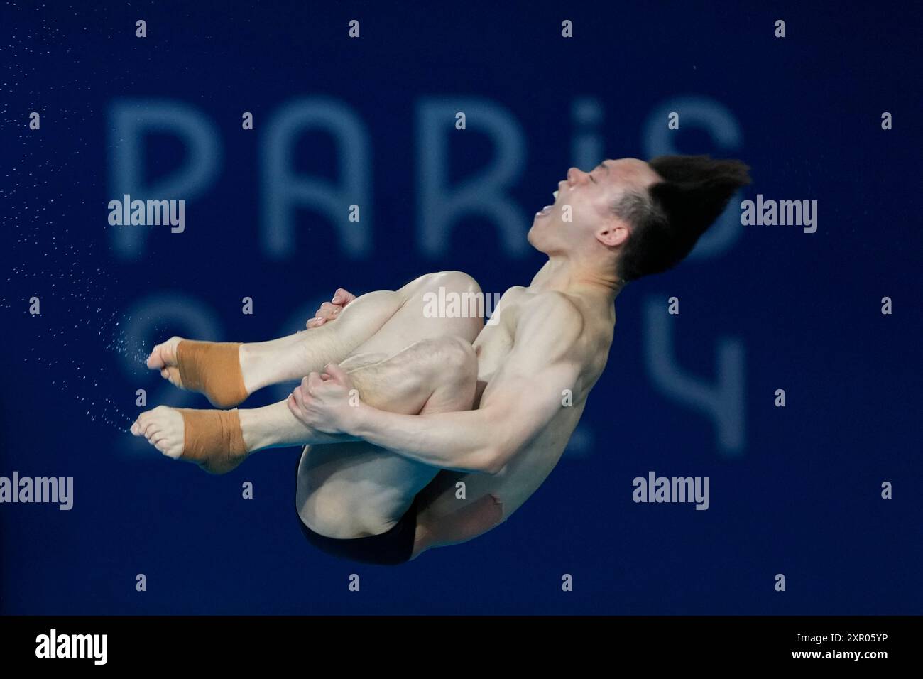 China's Xie Siyi competes in the men's 3m springboard diving final, at ...
