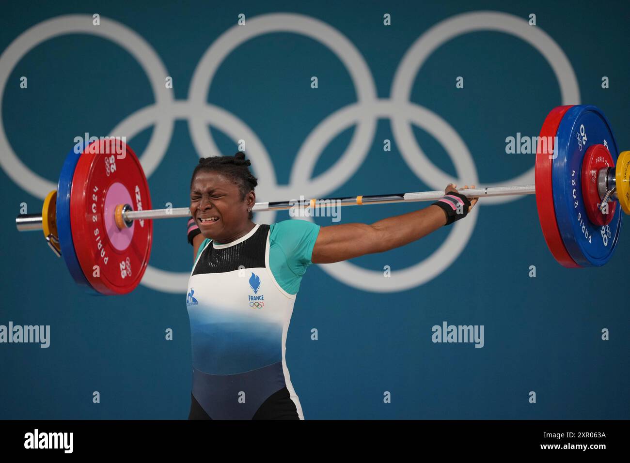 Dora Tchakounte of France reacts as she fails a lift during the women's ...