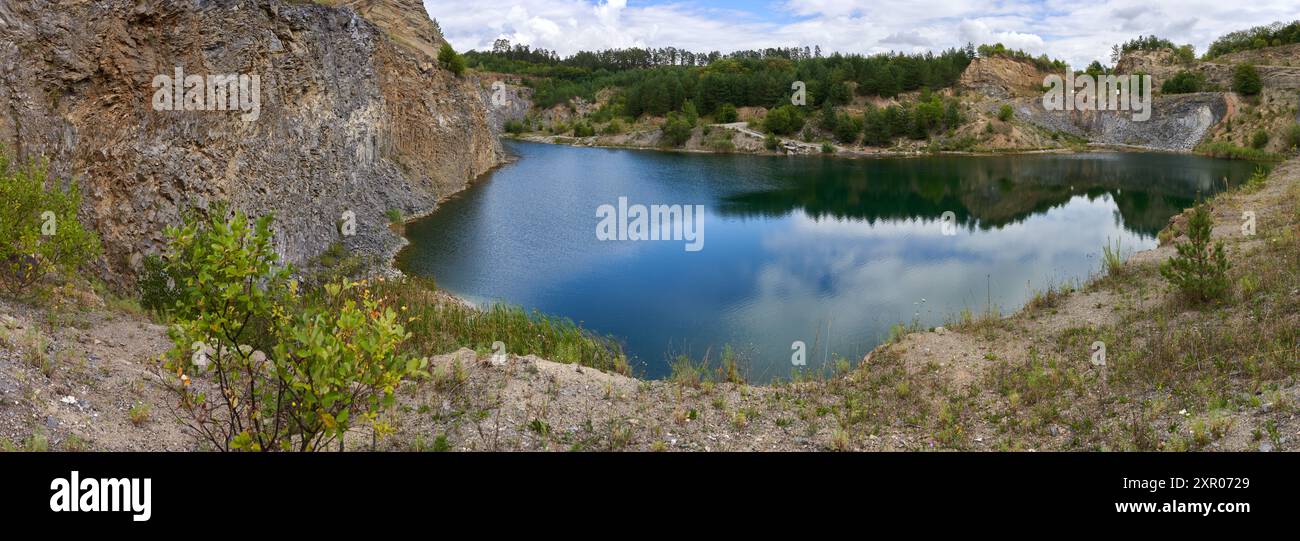 Azure lake formed in the place of an abandoned basalt and sandstone ...