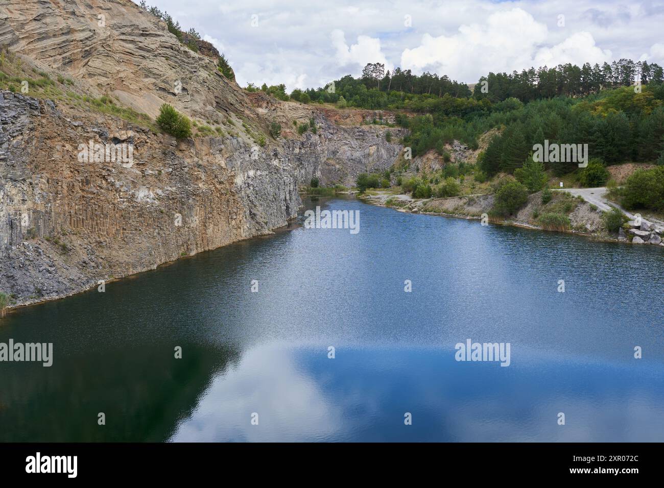 Azure lake formed in the place of an abandoned basalt and sandstone ...