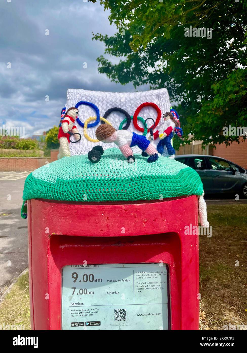 knitted olympic figures mounted on a post box in rushton somerset ...