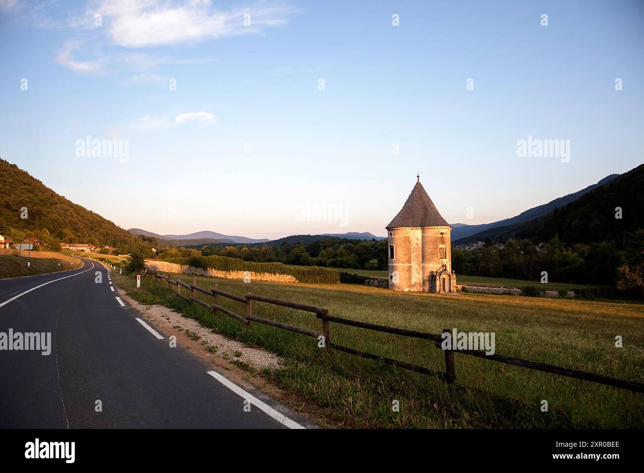 Spectacular Devil's Tower and a local road passing bye, surrounded with ...