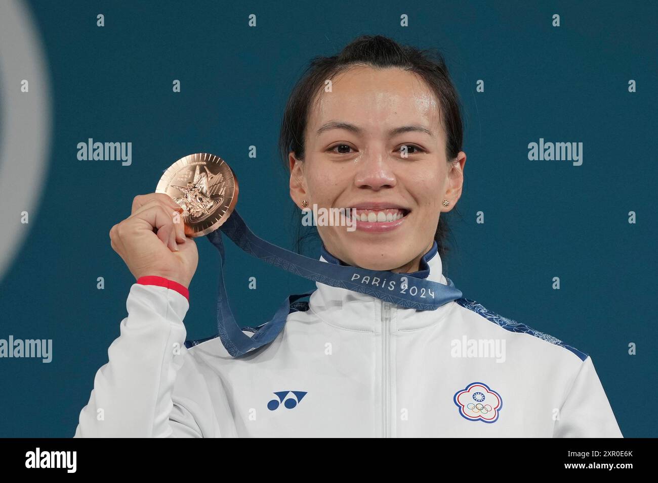 Bronze medalist Kuo Hsing-Chun of Taiwan celebrates on the podium ...