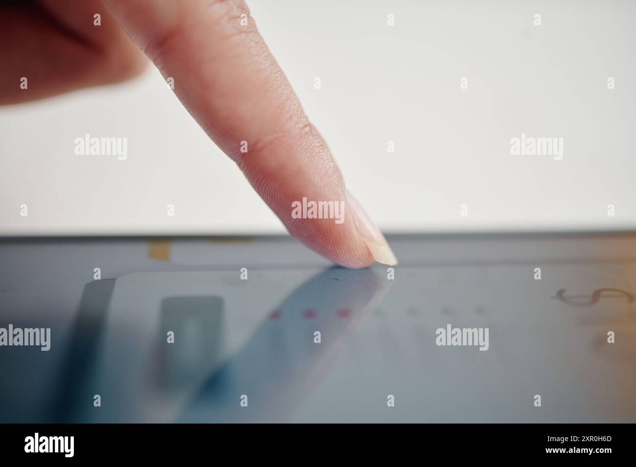 Using Technology with Finger Touching Screen Device Stock Photo - Alamy