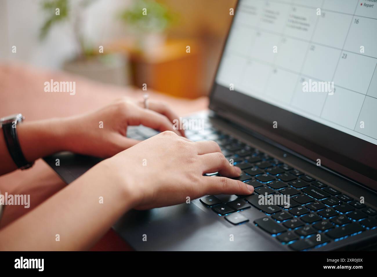 Typing on Laptop Keyboard while Viewing Calendar Screen Stock Photo - Alamy