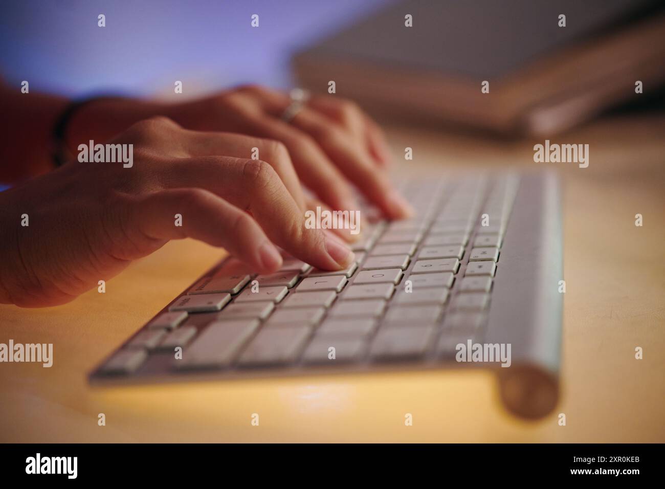 Typing on Keyboard with Focused Hand Movements Stock Photo - Alamy