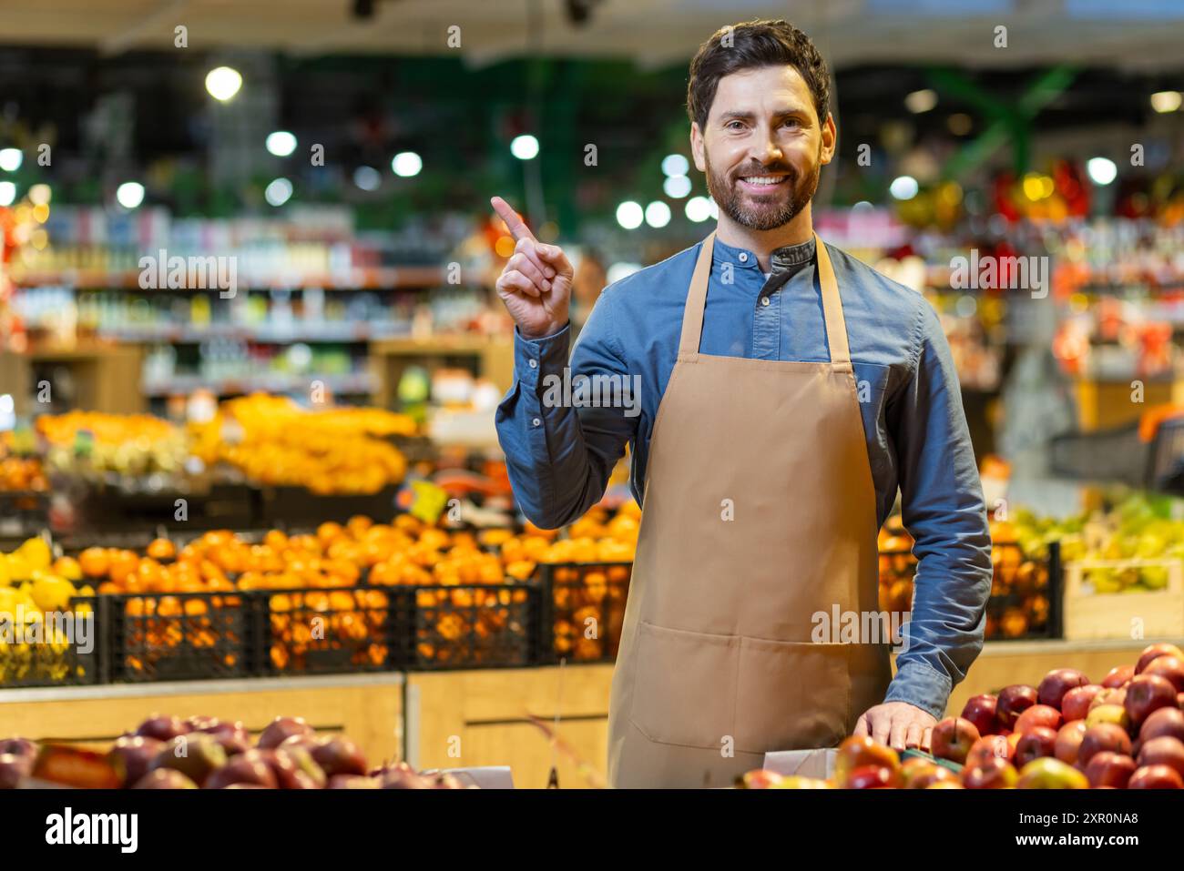 Smiling mature pointing finger hi-res stock photography and images - Alamy