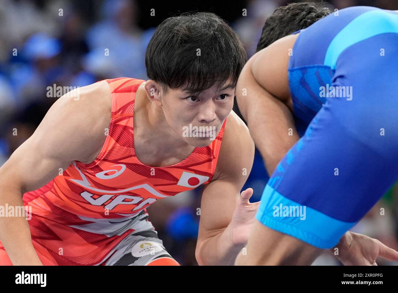 Japan's Rei Higuchi, left, and India's Aman Aman compete in their men's freestyle 57kg semifinal ...