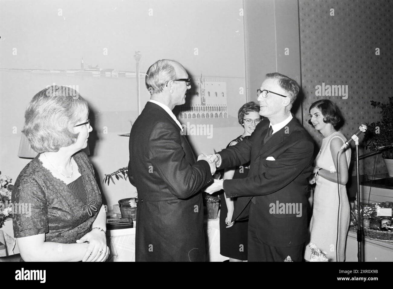 Reception, man receives congratulations and gifts Stock Photo - Alamy