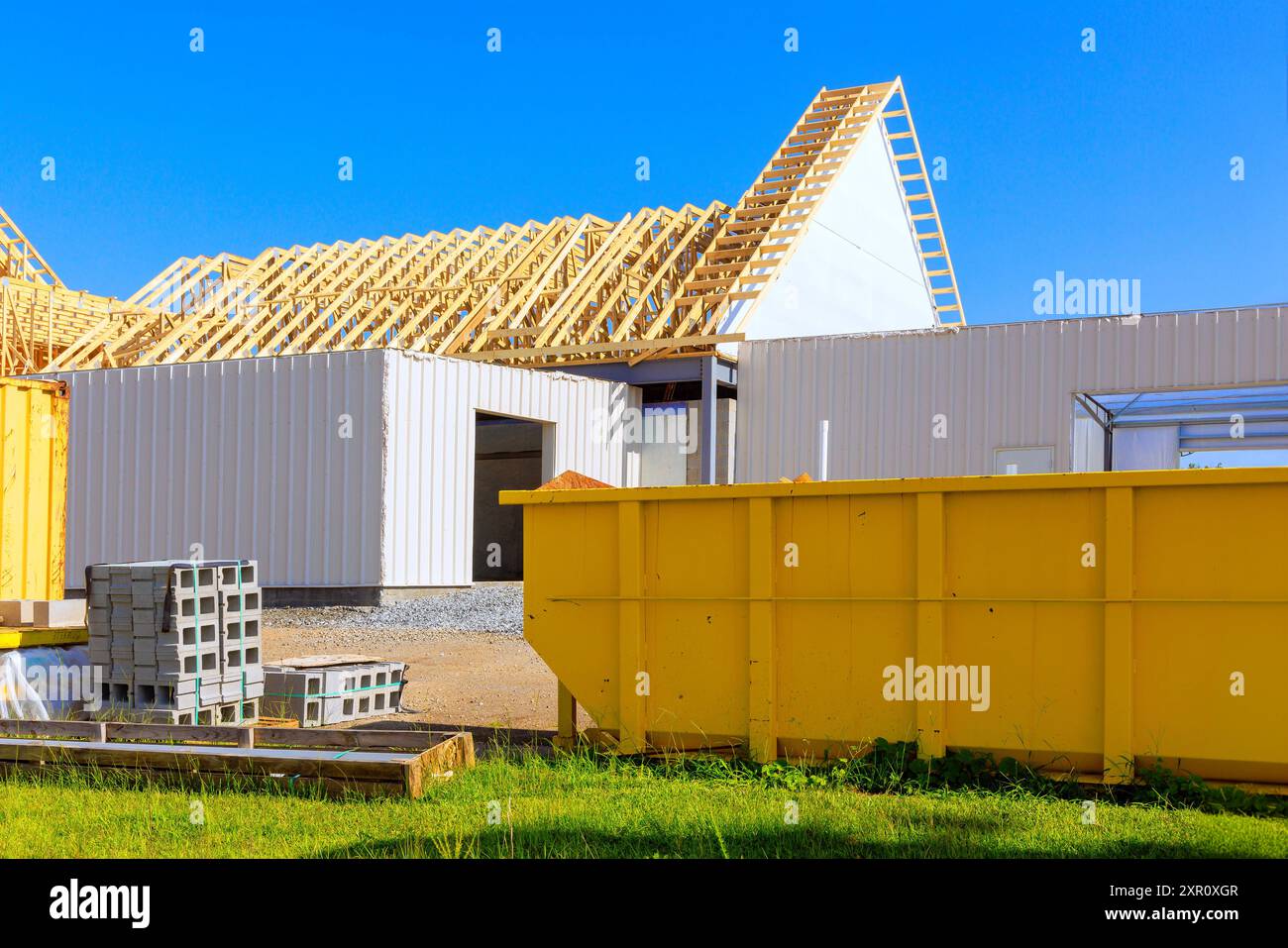 On construction site, metal containers are used to store waste during ...