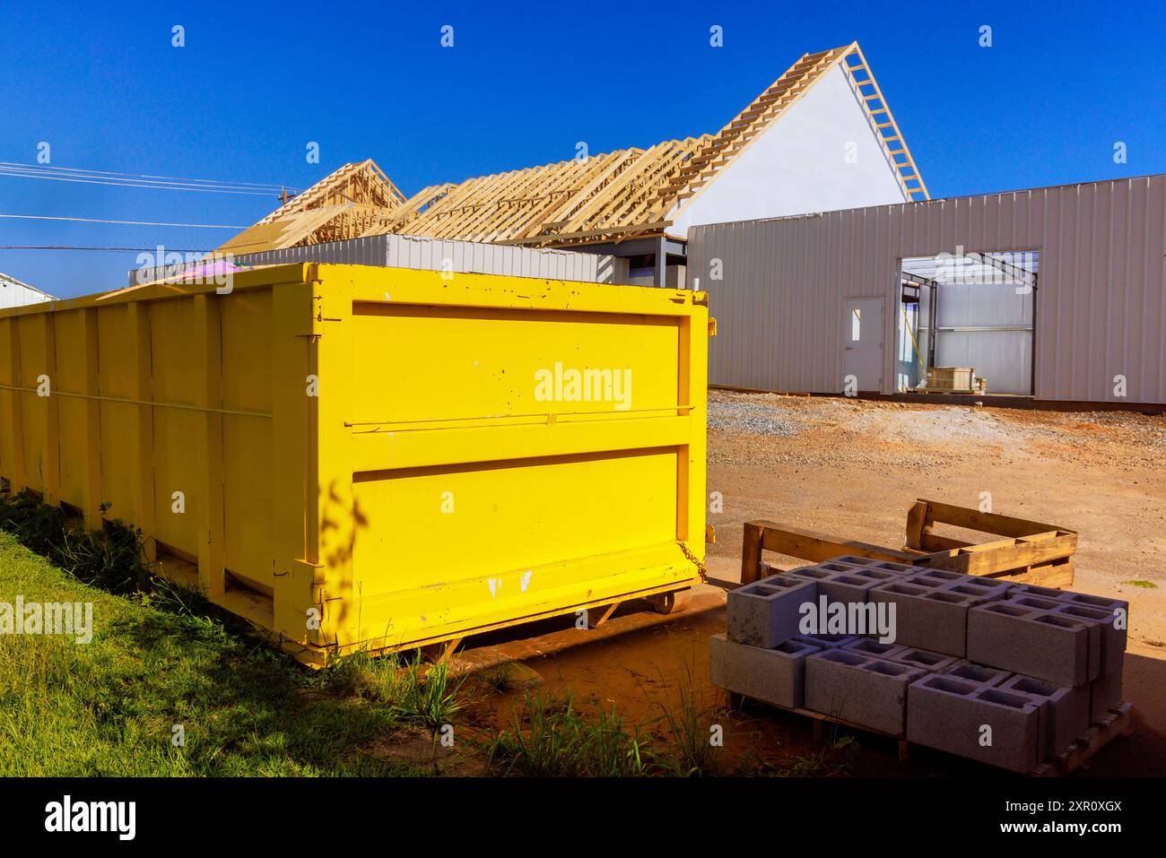 Metal container dumpsters for waste during construction at construction ...