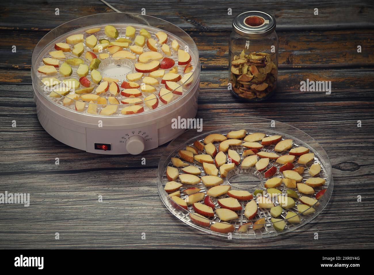 apple slices on the drying rack ready for drying Stock Photo - Alamy