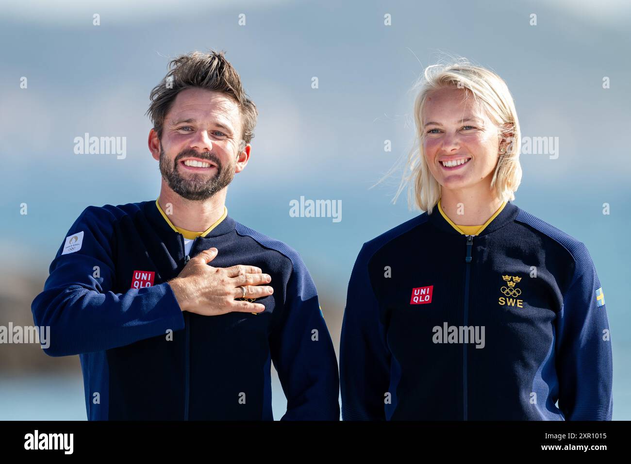 Anton Dahlberg and Lovisa Karlsson of, Sweden. , . celebrate at the medal ceremony for mixed ...