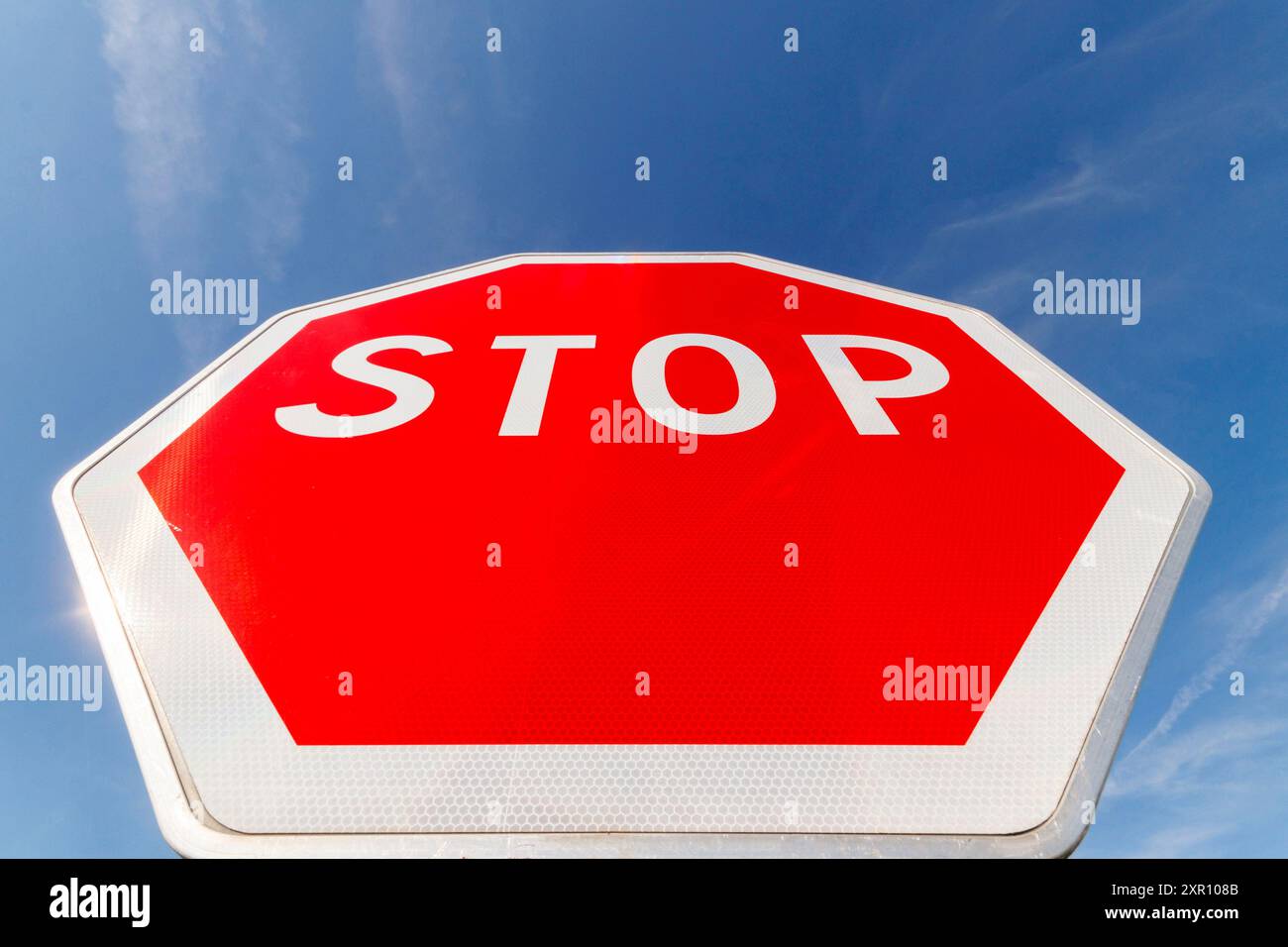 stop sign isolated against blue sign france Stock Photo - Alamy