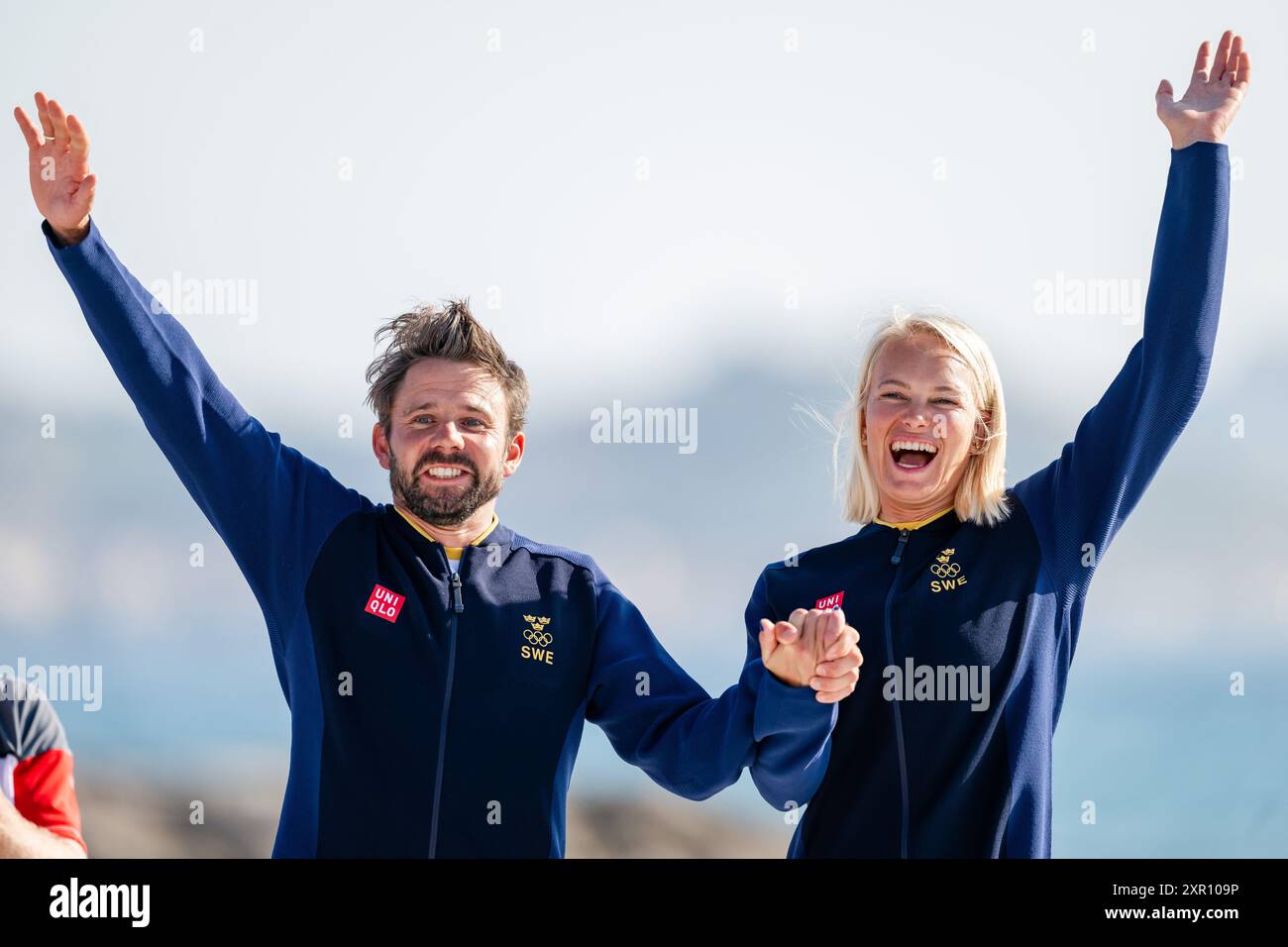 Anton Dahlberg and Lovisa Karlsson of, Sweden. , . celebrate at the medal ceremony for mixed ...