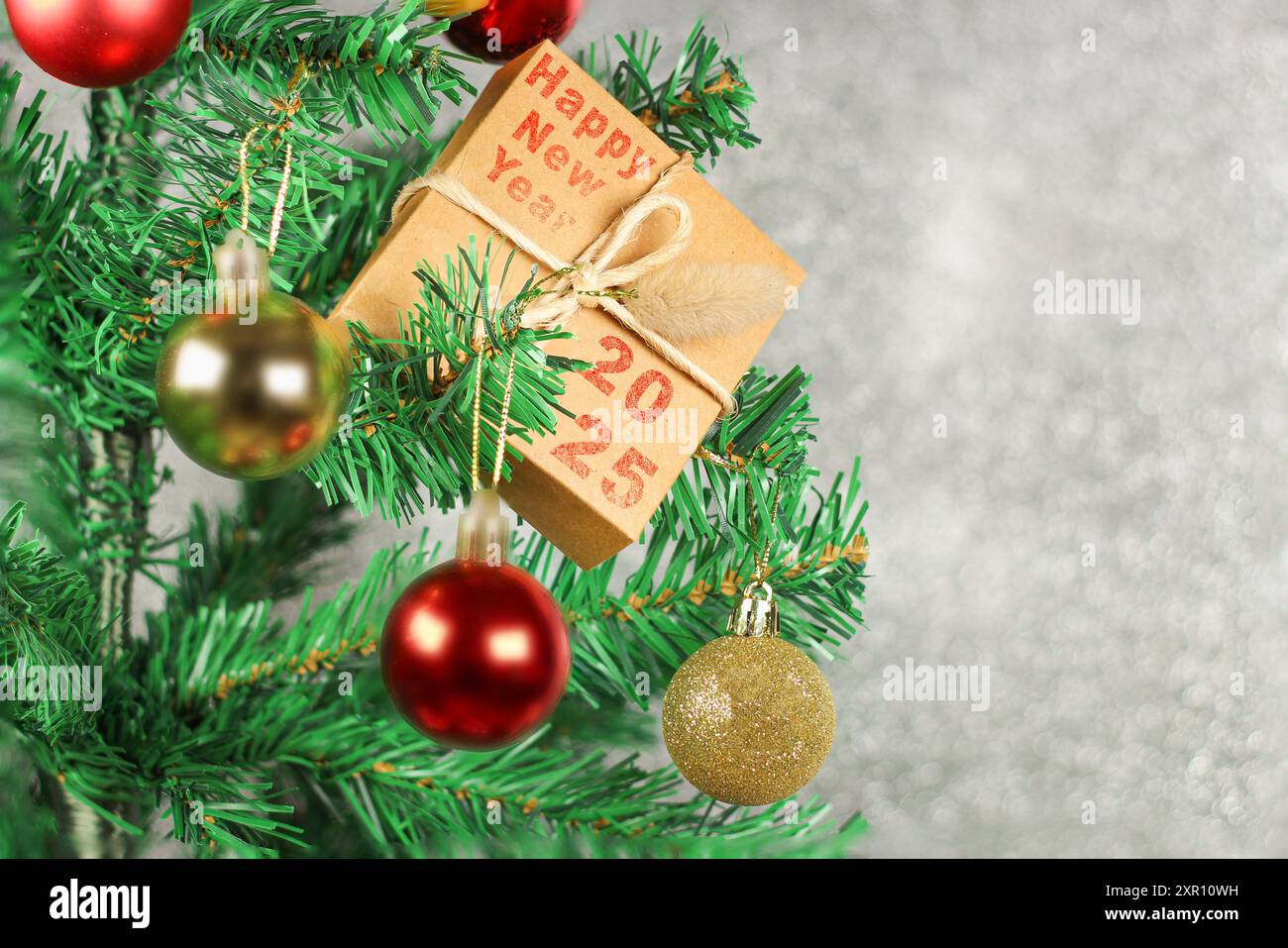 Gift box with happy new year and 2025 written in red on top of ...