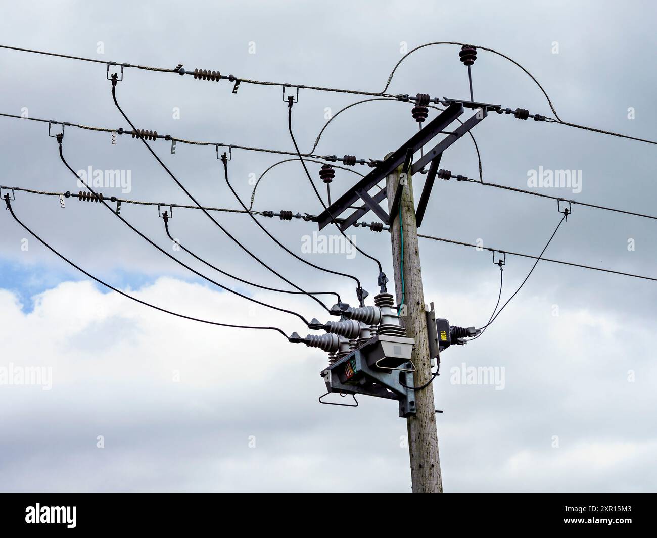 Electrical power lines and transformers on a wooden utility pole ...