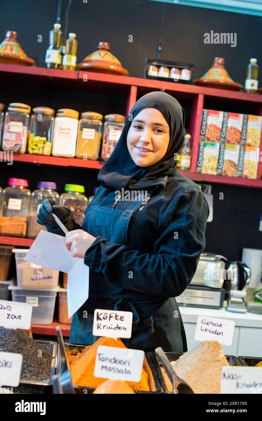 Moslima woman serving hi-res stock photography and images - Alamy