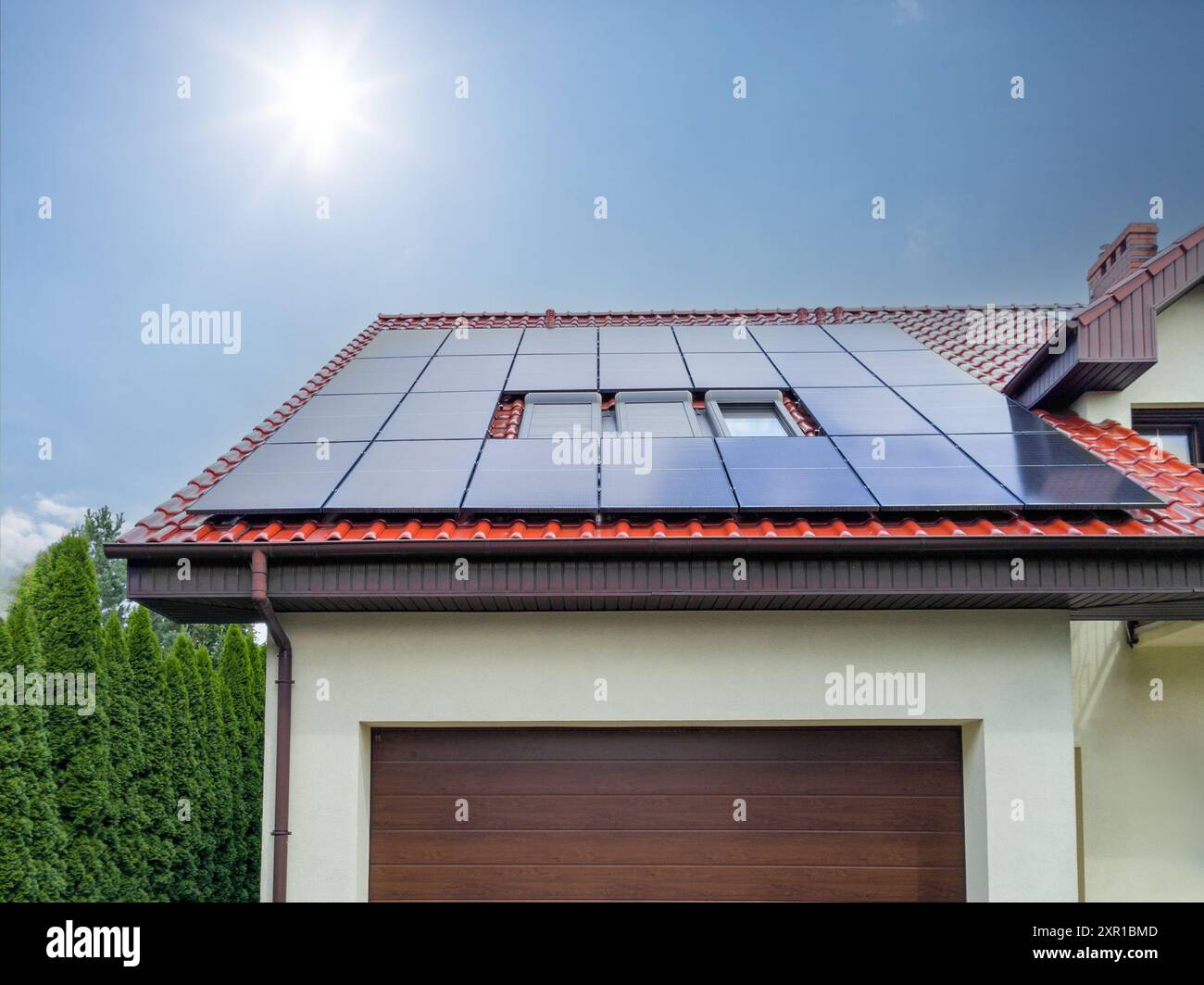 Solar Panels on Red Tiled Roof Stock Photo - Alamy