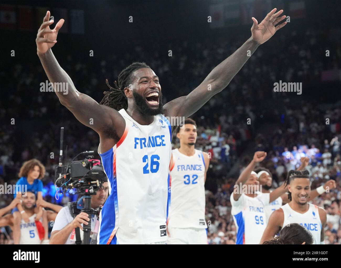 France center Mathias Lessort (26) celebrates the 73-69 win over ...