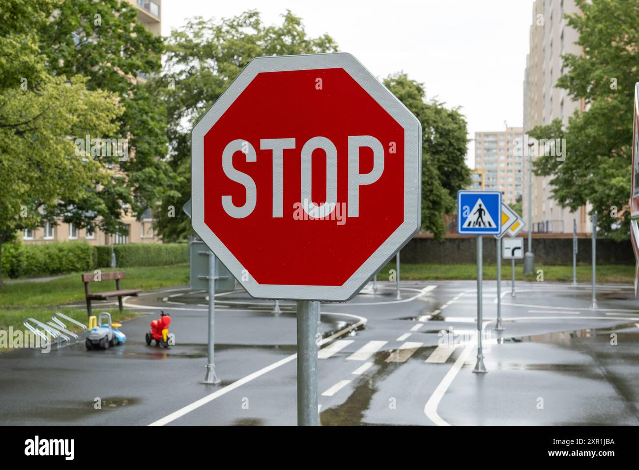 stop road sign on kid's playground designed as a mini road with signs ...