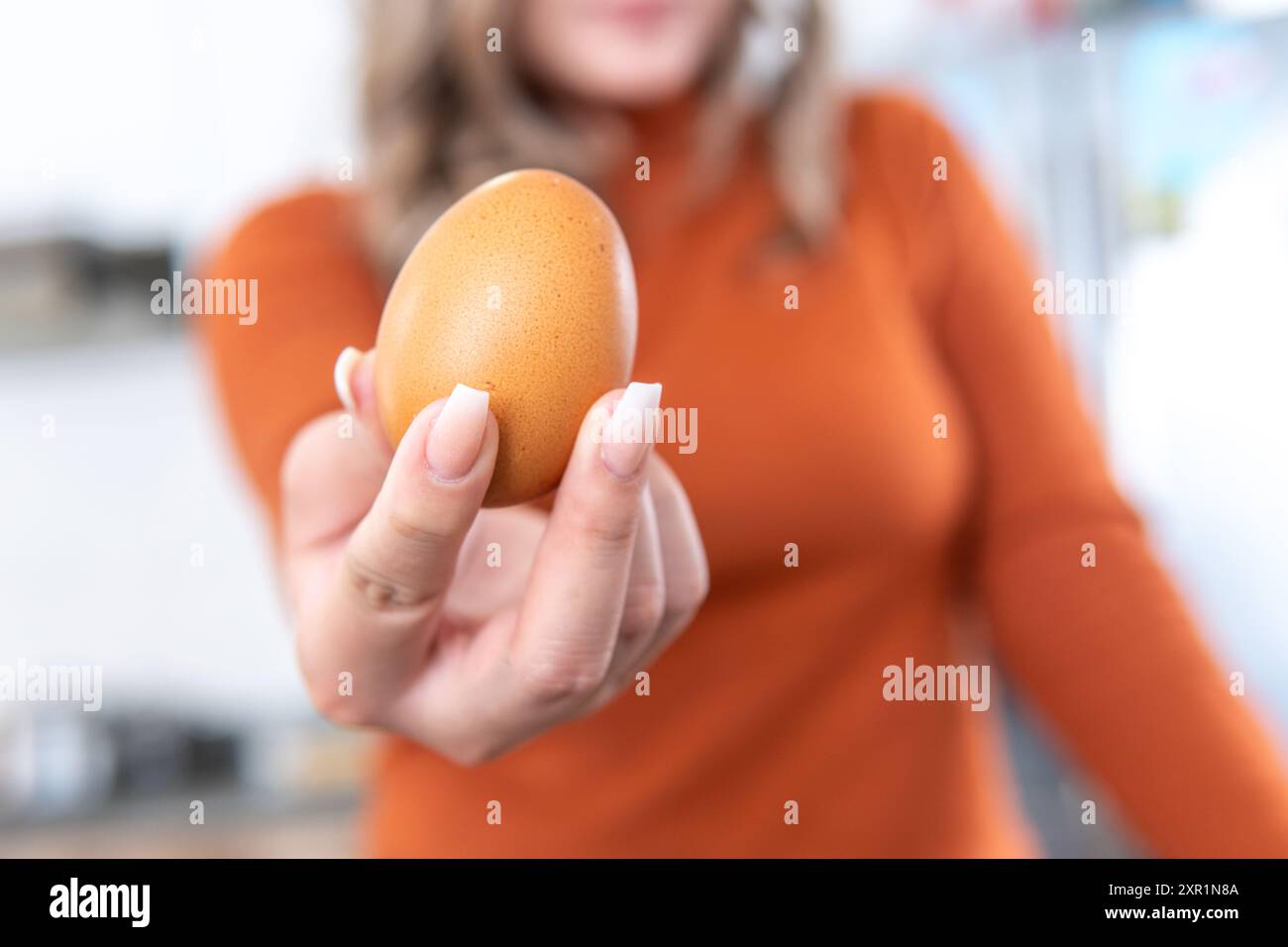 closeup of an unrecognizable woman's hand showing an egg Stock Photo ...